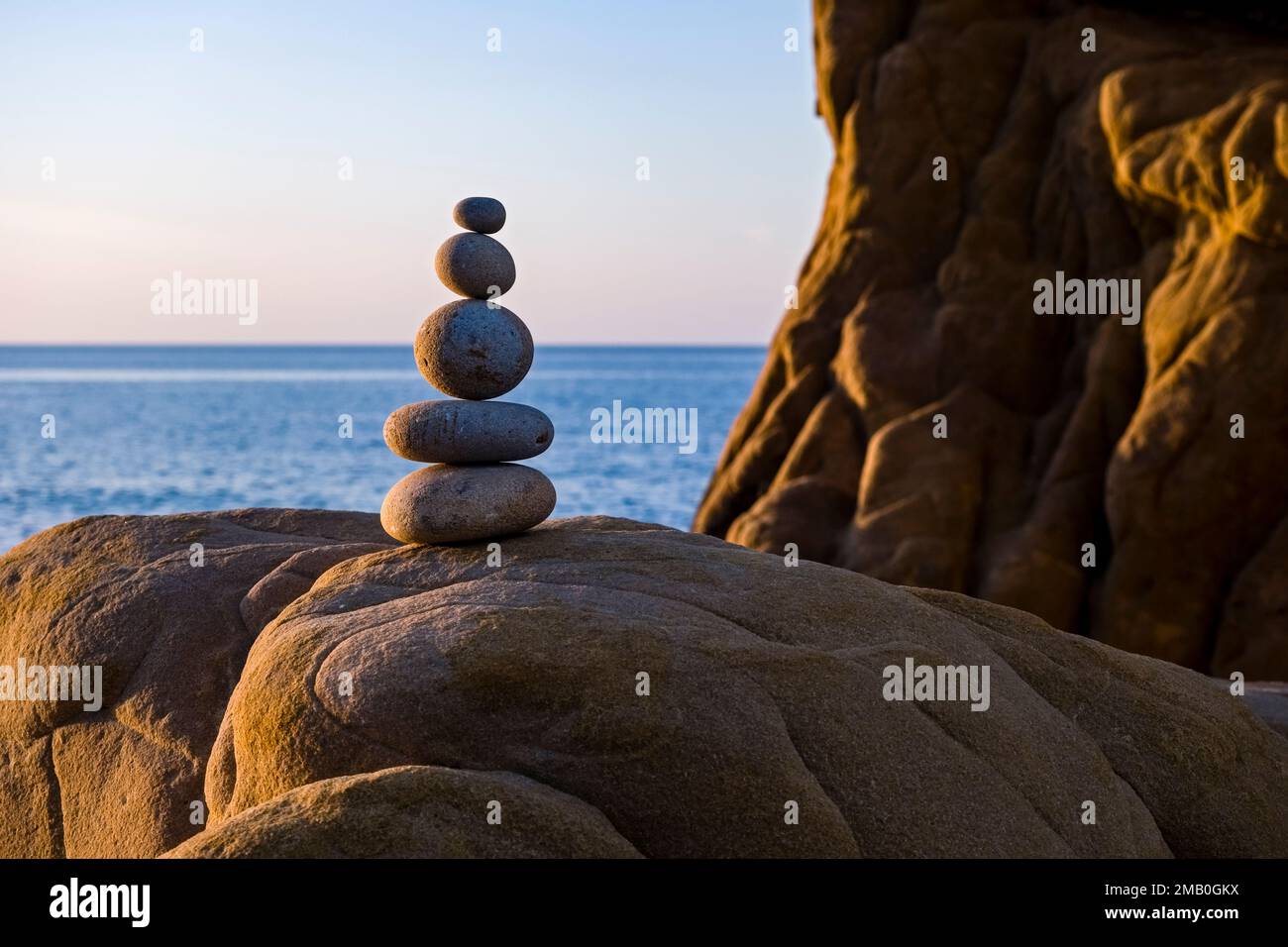 A well-balanced cairn on the beach of the small town of Castle di Tusa ...