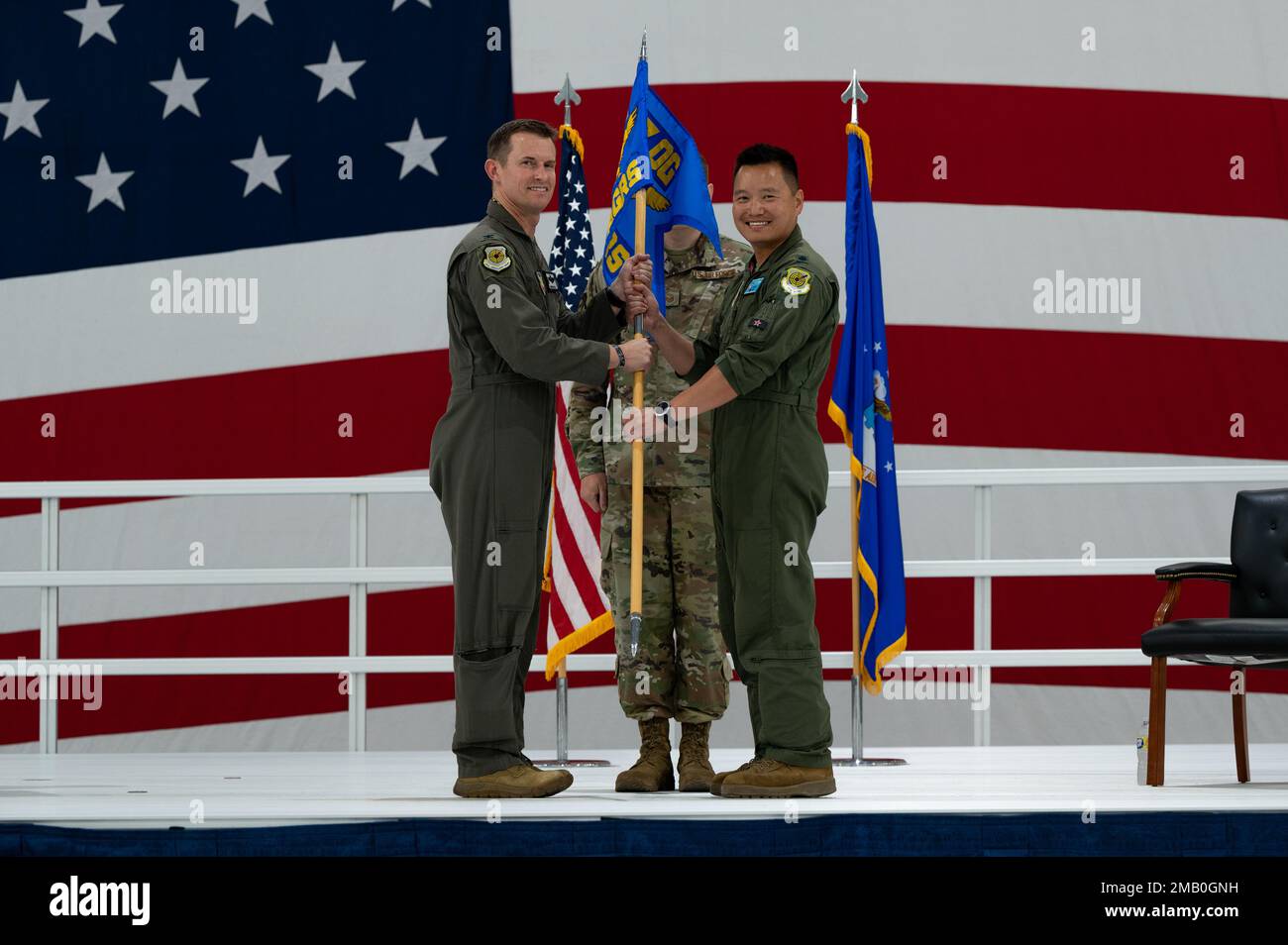 Col. Scott Mills, 57th Operations Group commander, passes the guidon of ...