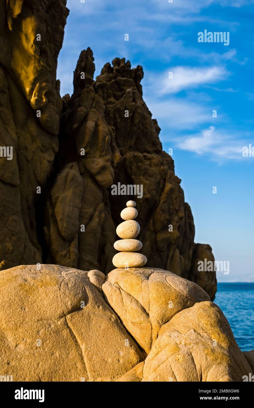 A well-balanced cairn on the beach of the small town of Castle di Tusa ...