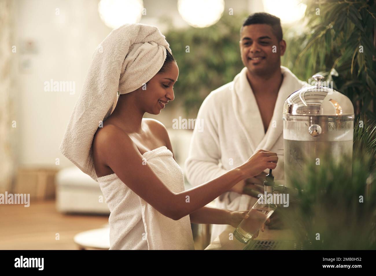 What do you want to do next. a couple getting water from a dispenser in ...