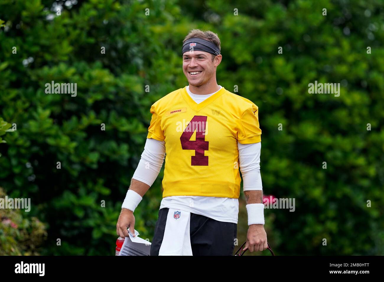 Washington Commanders quarterback Taylor Heinicke (4) walks to practice ...
