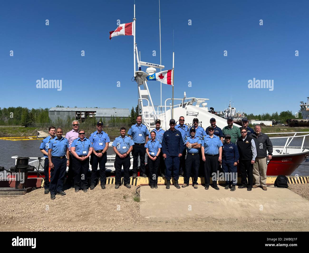 Canadian Coast Guard, U.S. Coast Guard, and civilian personnel pose in ...