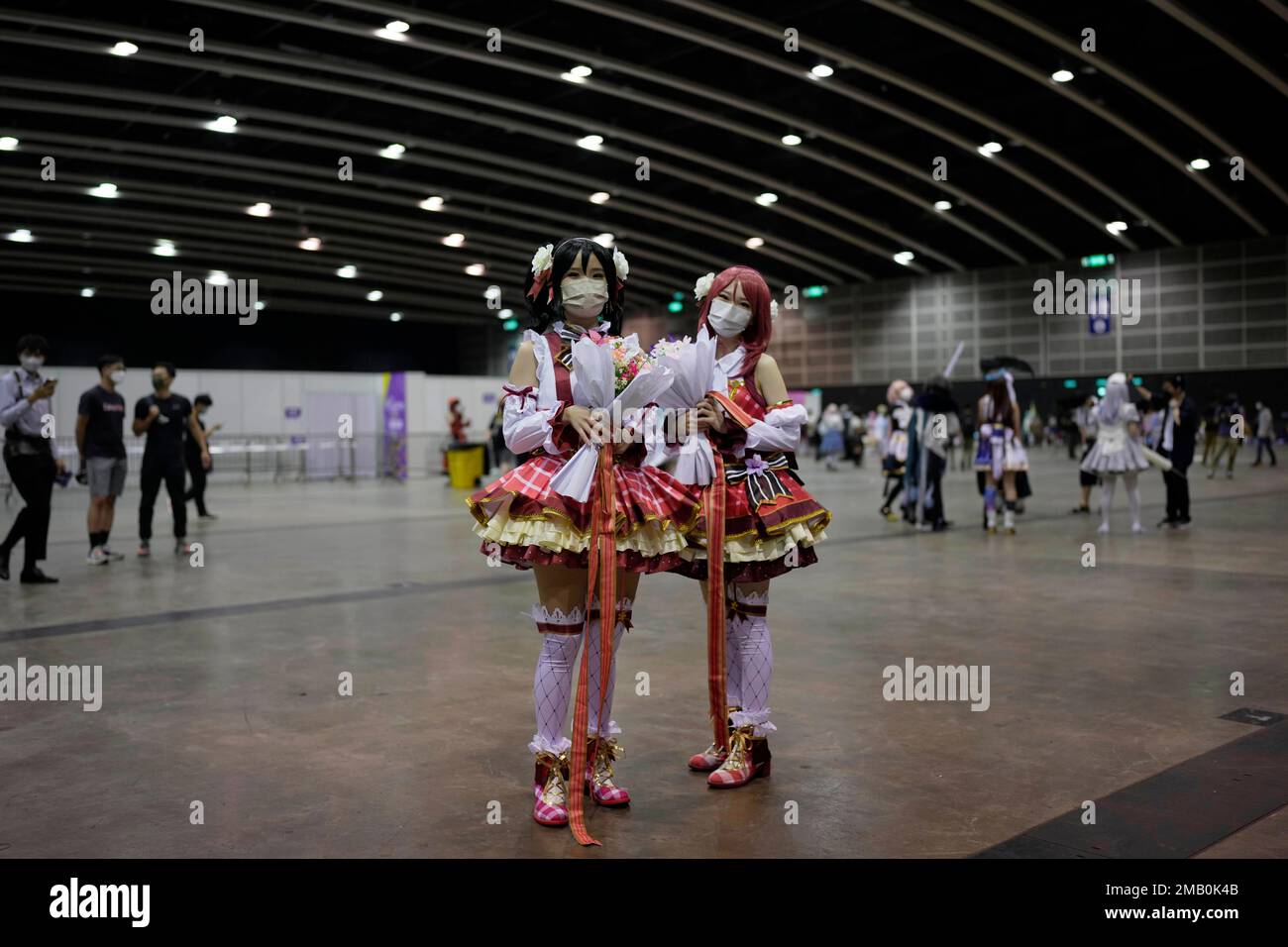 Participants wearing face masks and their cosplay featuring a character ...