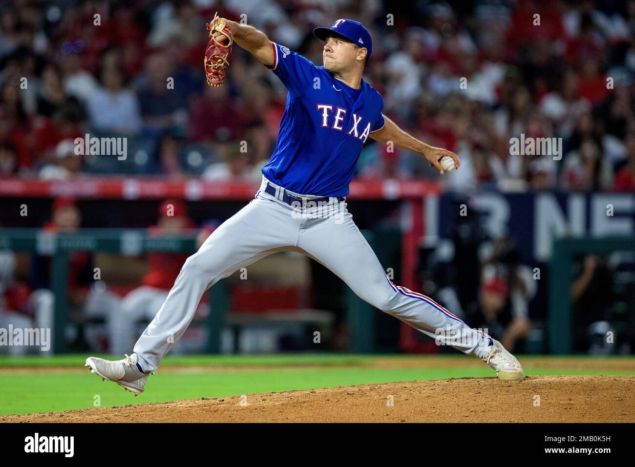 Texas Rangers relief pitcher Brock Burke throws to a Los Angeles Angels ...