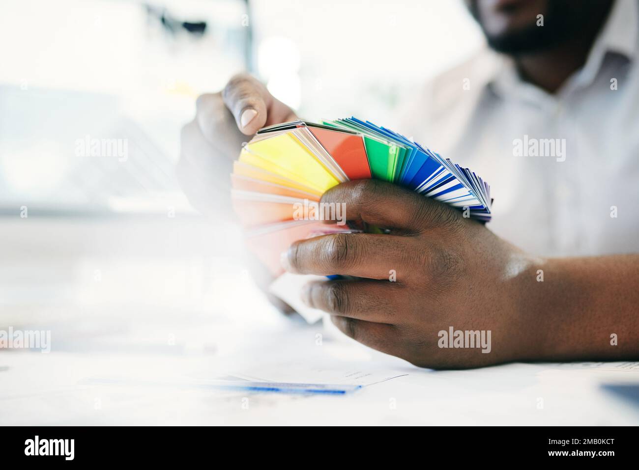 Which colour should I use. an unrecognizable man holding various ...