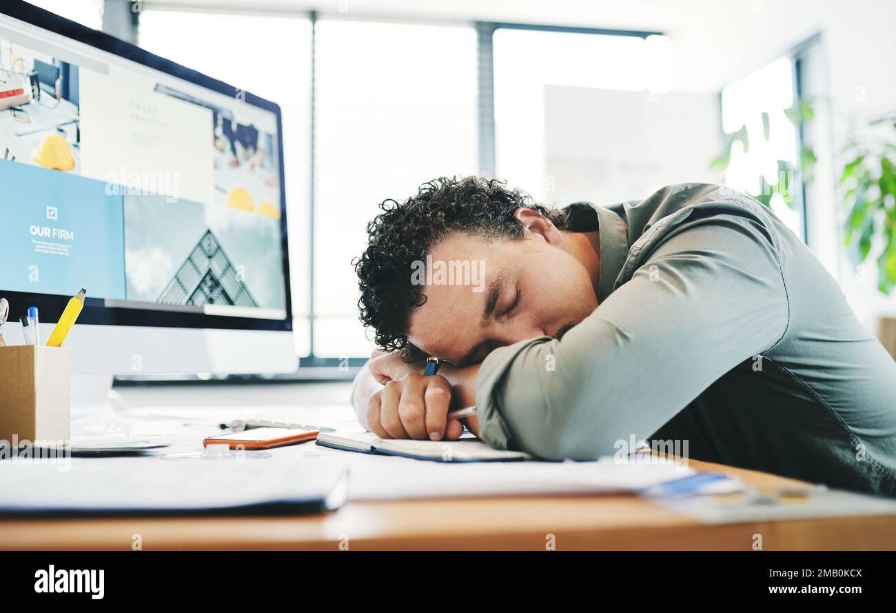 Short naps are essential to being productive. a young businessman ...