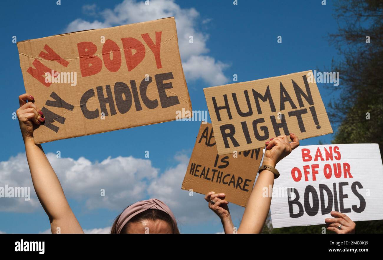 Protesters holding signs My Body My Choice, Human right, Bans Off Our ...