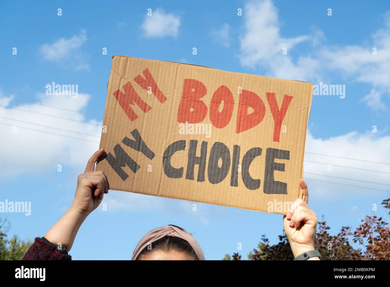 Woman Holding Placard Sign With Slogan My Body My Choice During