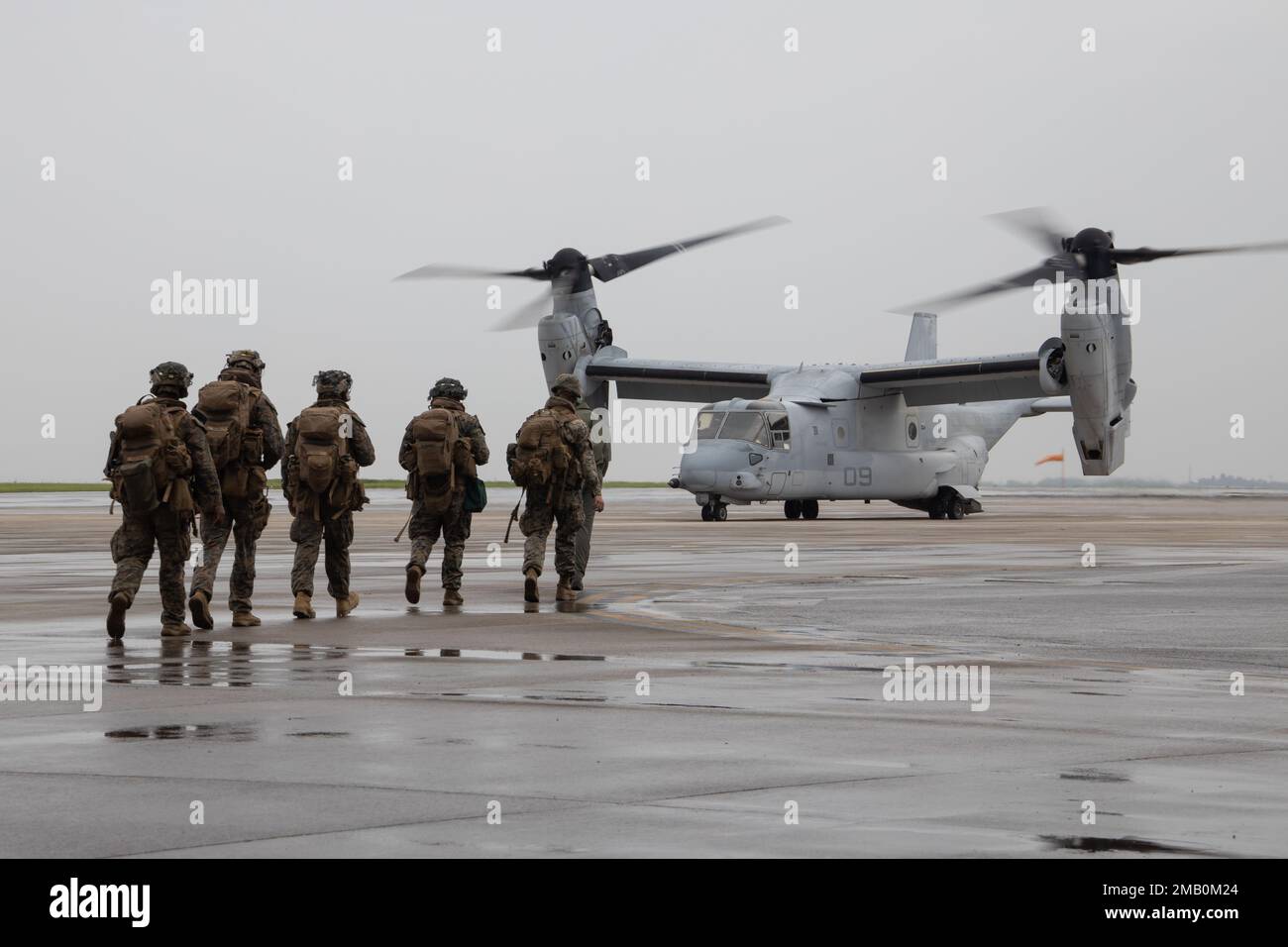 U.S. Marines with 3d Battalion, 2d Marines prepare to board an MV-22B ...