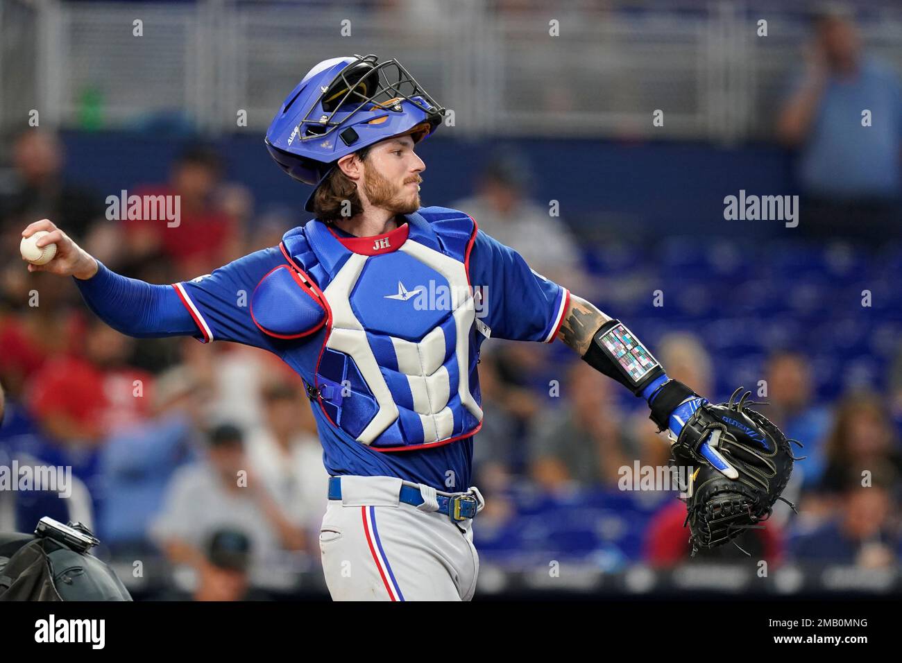 Texas Rangers catcher Jonah Heim throws back to the pitcher during the ...