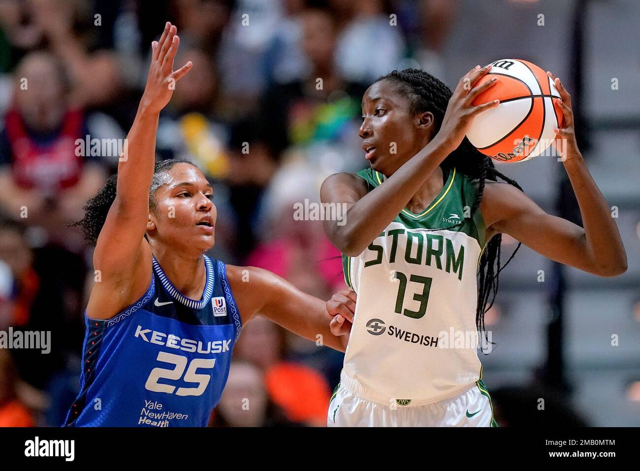 Seattle Storm center Ezi Magbegor (13) is defended by Connecticut Sun ...