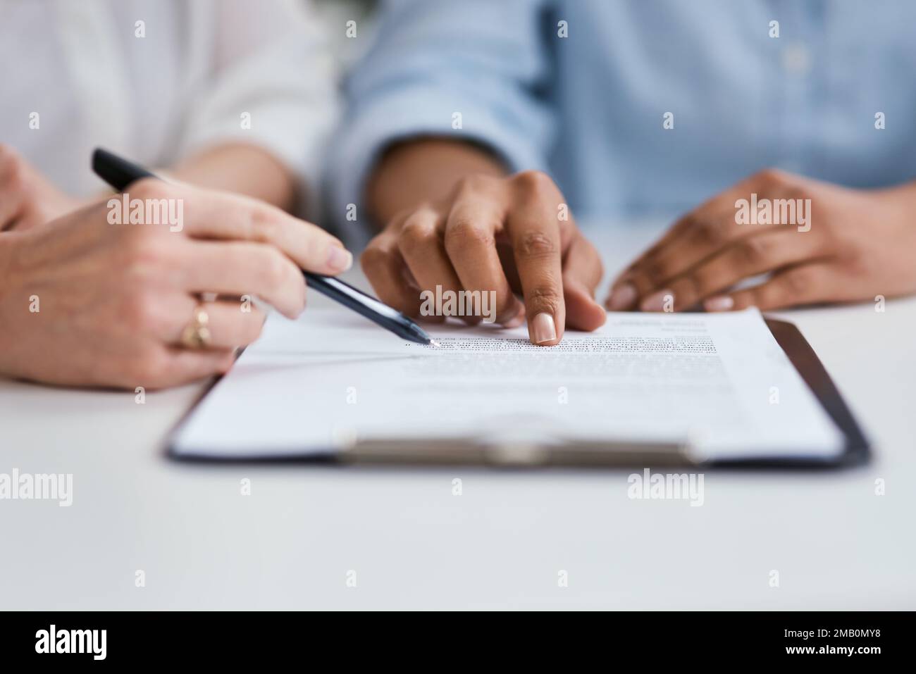 Reviewing new information. Closeup shot of two unrecognisable ...