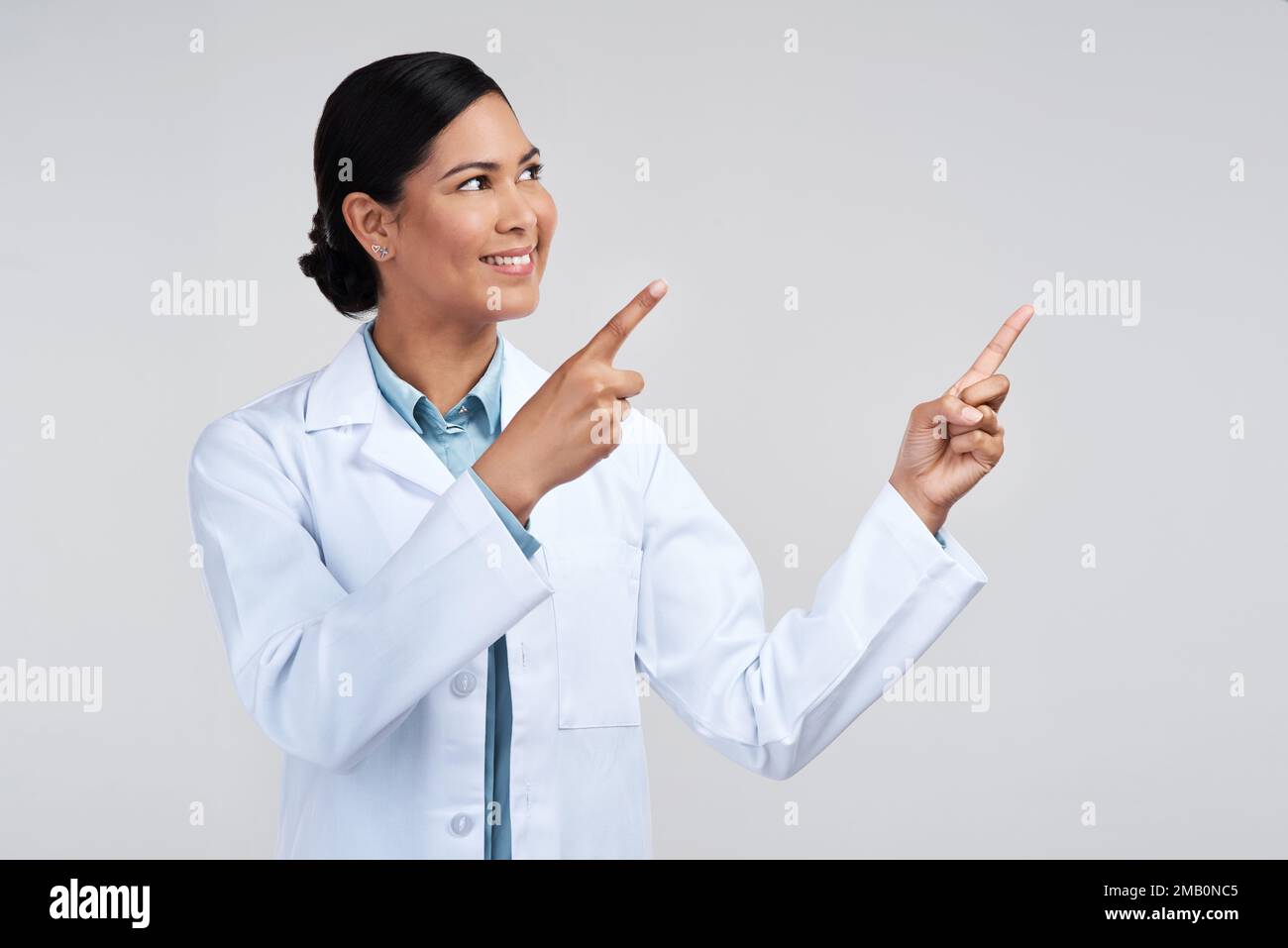 Picture your name in lights. an attractive young female scientist ...