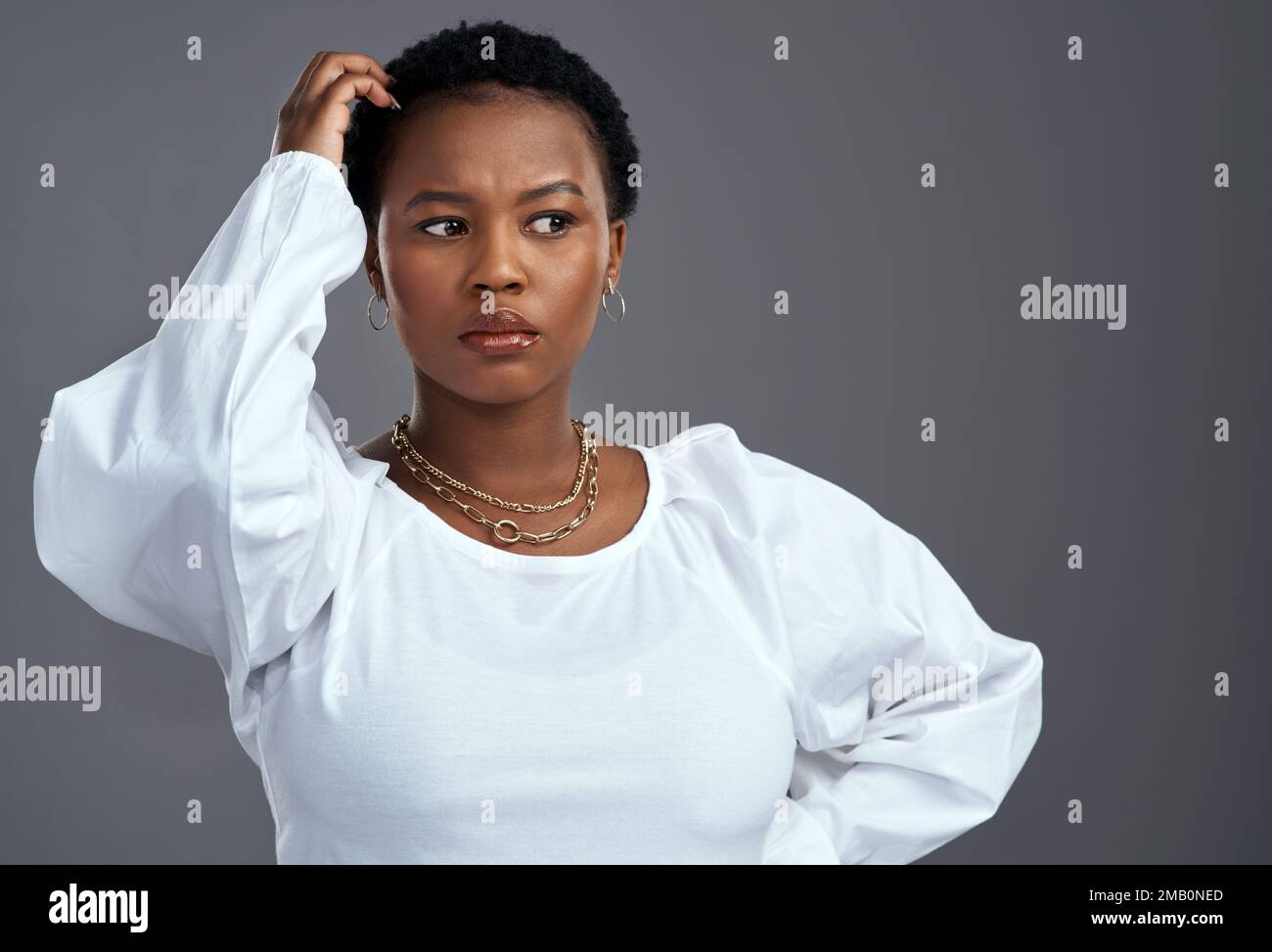 I need a minute to process this. a young woman looking puzzled while ...