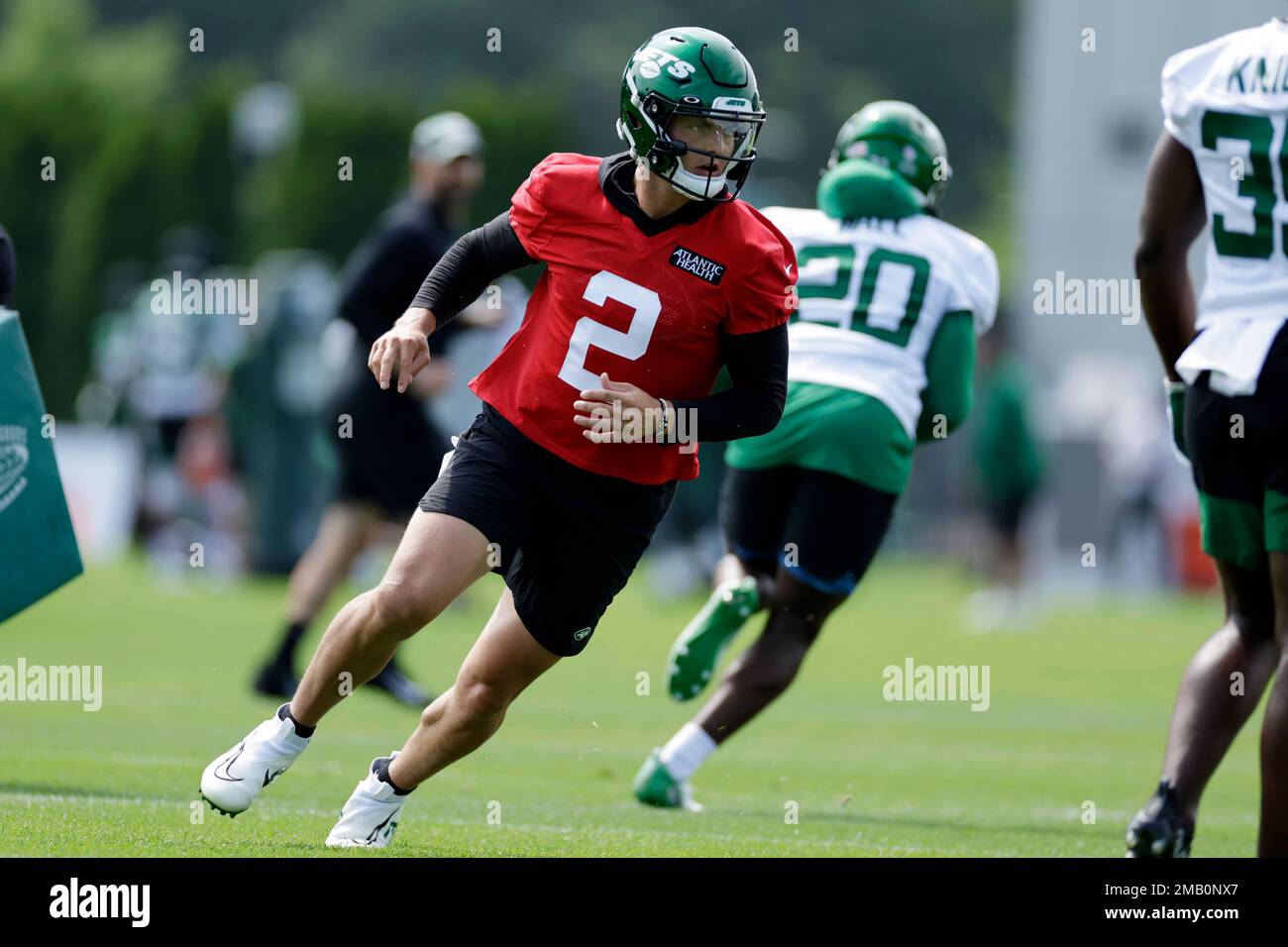 New York Jets quarterback Zach Wilson takes part in drills at the NFL ...
