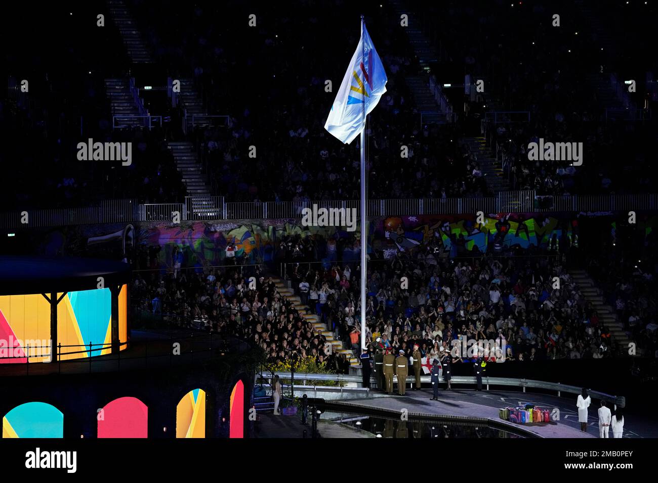 The Commonwealth Games flag is hoisted during the games opening ...
