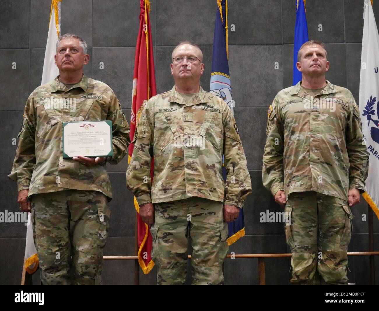 Chief Warrant Officer 5 Jimmy Graham (center) is awarded the Legion of ...