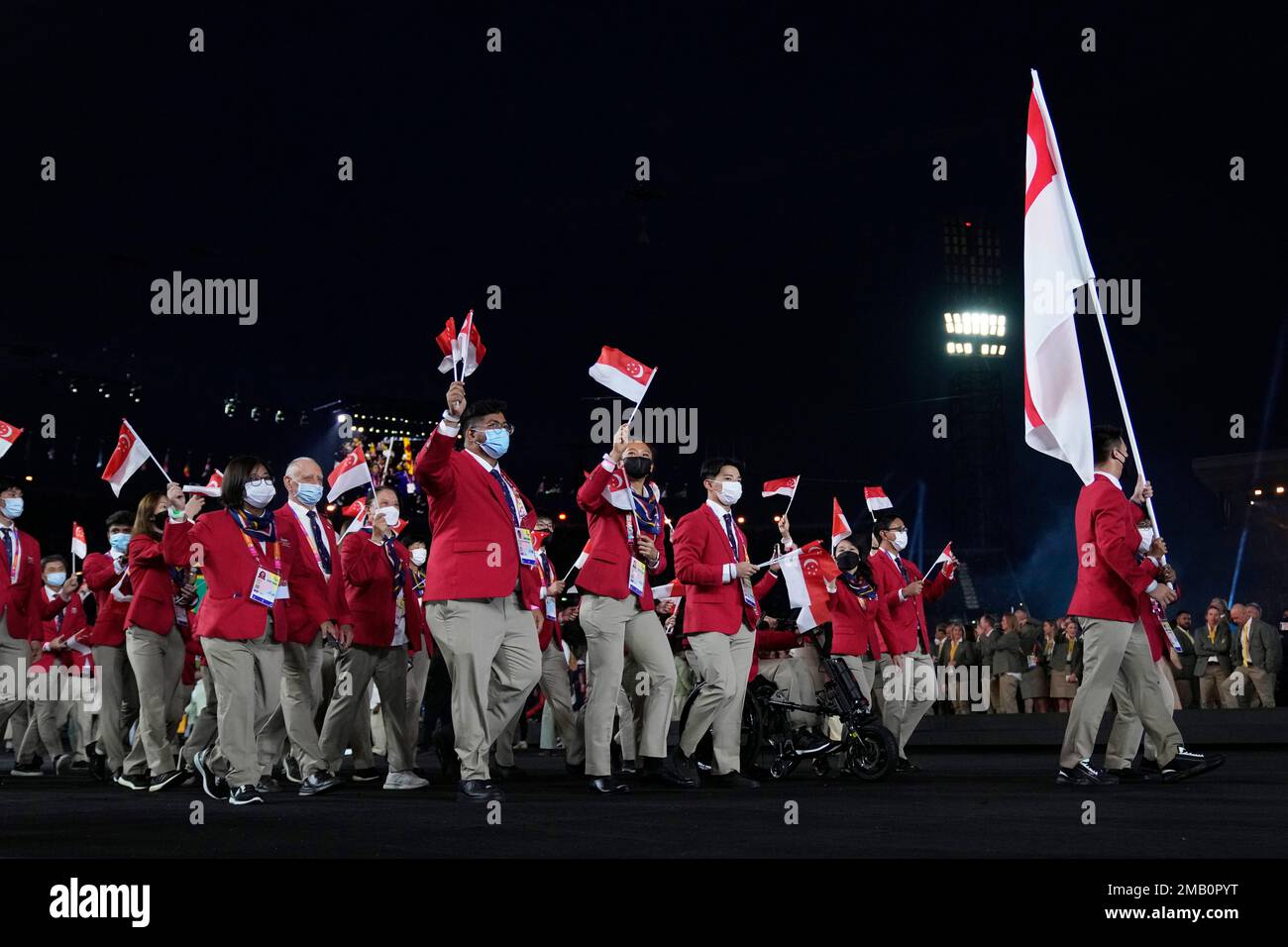 The athletes of Singapore enter the stadium during the Commonwealth ...