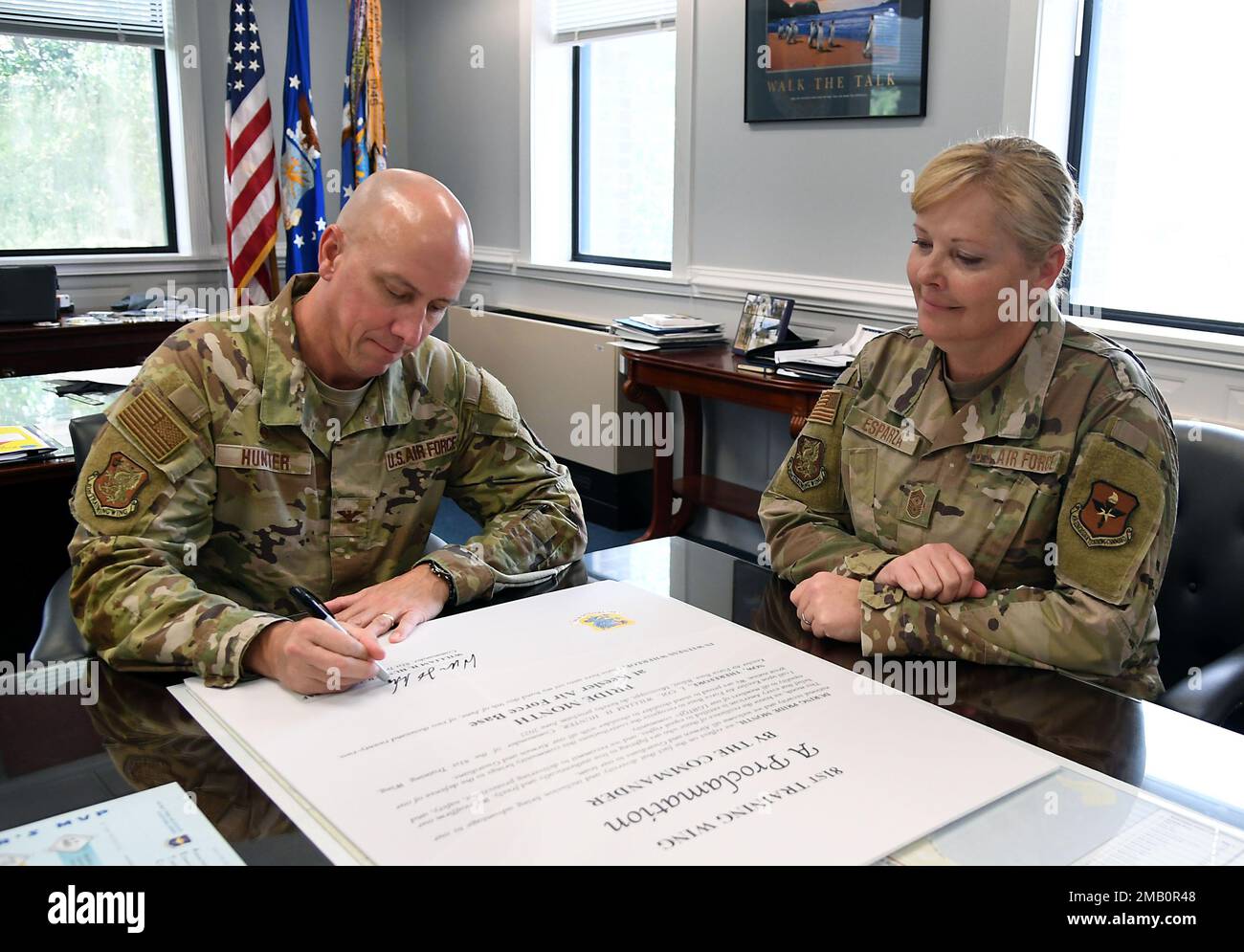 U.S. Air Force Col. William Hunter, 81st Training Wing commander, signs ...