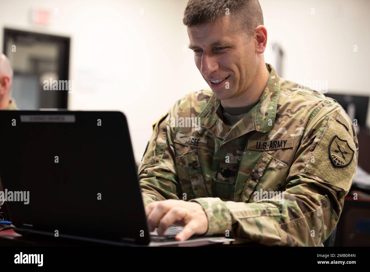 Lt. Col. Chris Elgee of the 126th Cyber Protection Battalion works in ...