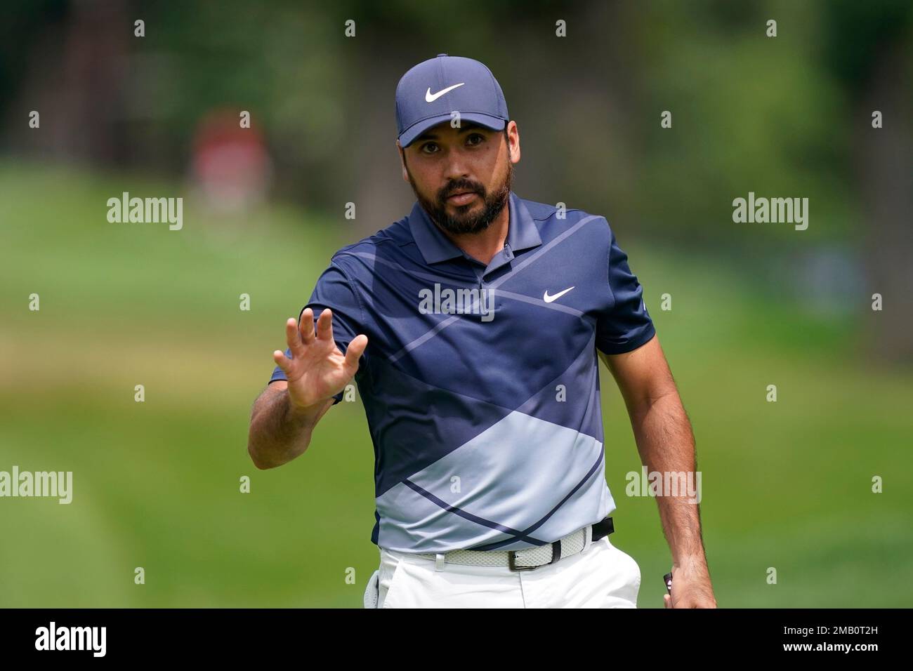 Jason Day of Australia acknowledges the fans after his putt on the 9th ...