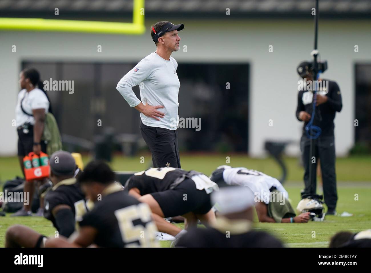 New Orleans Saints head coach Dennis Allen walks on the field for ...