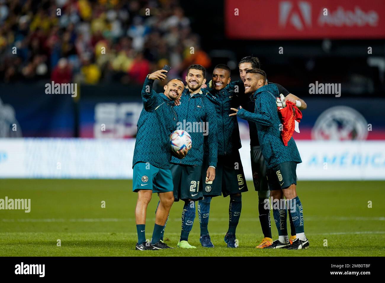 América players take a selfie on the field after a friendly soccer ...