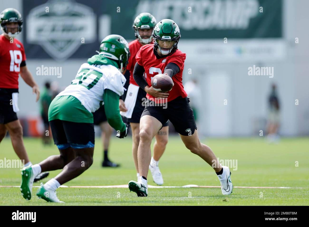 New York Jets quarterback Zach Wilson takes part in drills at the NFL ...