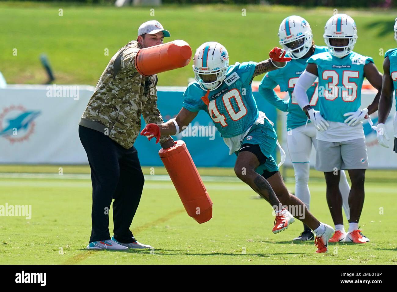 Miami Dolphins cornerback Nik Needham (40) takes part in drills at the ...