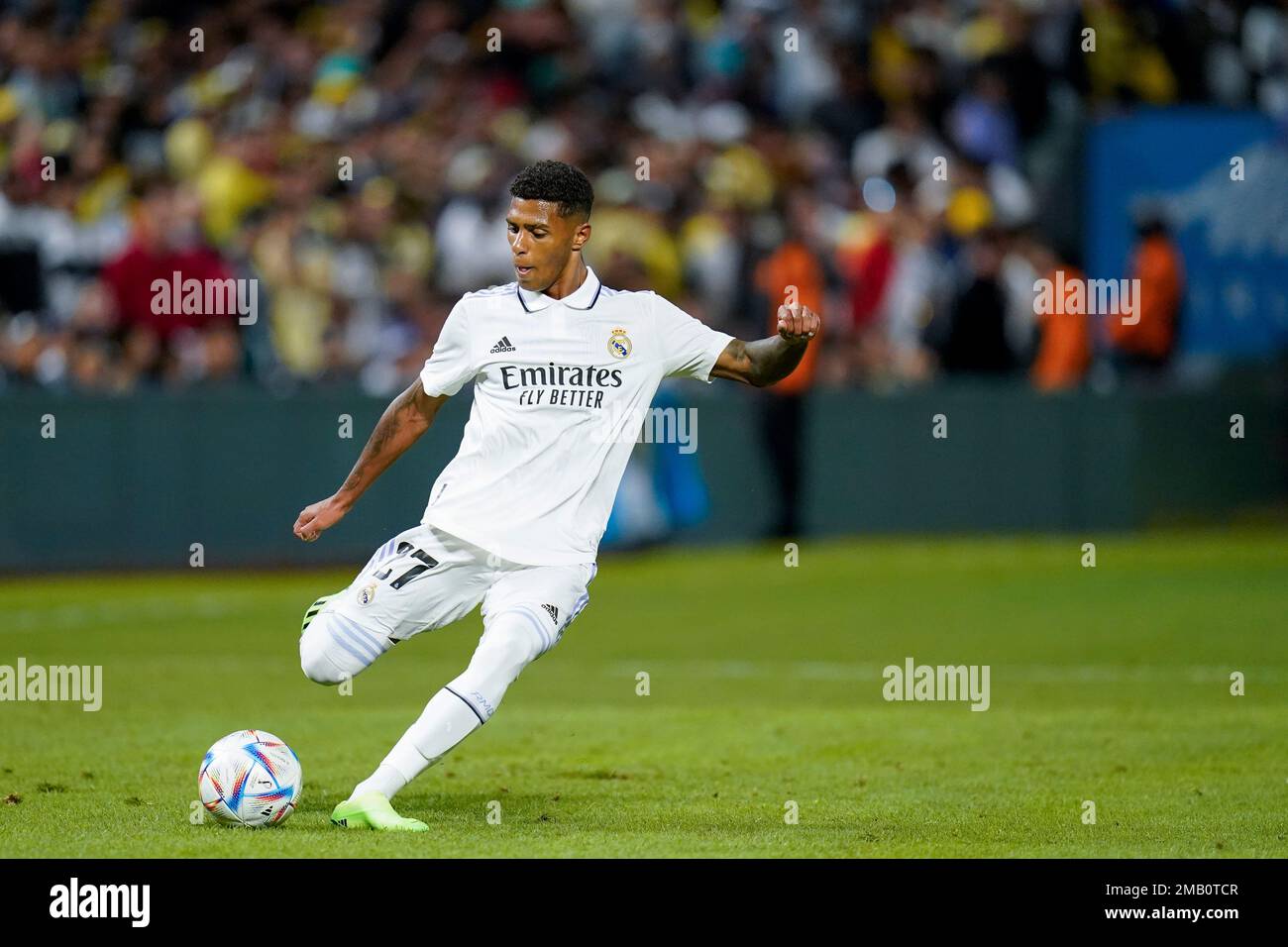 Real Madrid's Vinicius Tobias passes the ball against América during ...