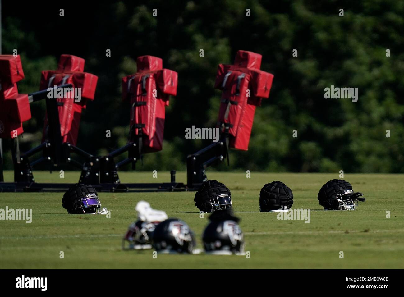 Atlanta Falcons player's helmets sit on the ground at the NFL football ...