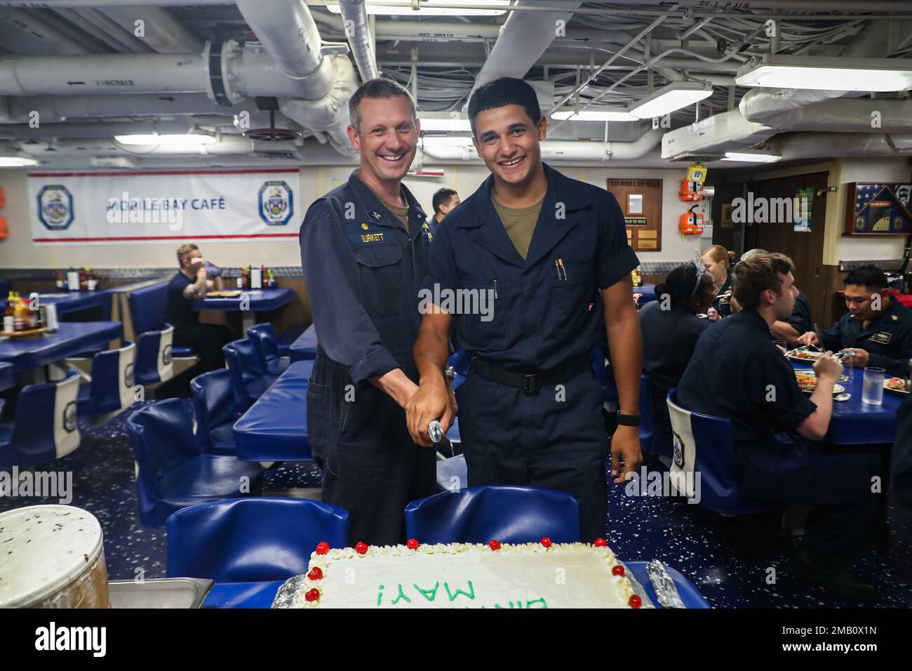 PHILIPPINE SEA (June 9, 2022) Commanding Officer Capt. Brandon Burkett, left, from Waterloo ...