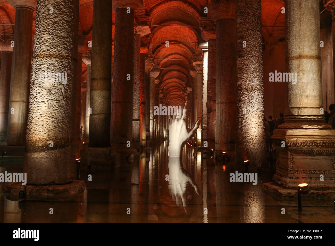 A hand shape sculpture is reflected in the water at the Byzantine-era ...