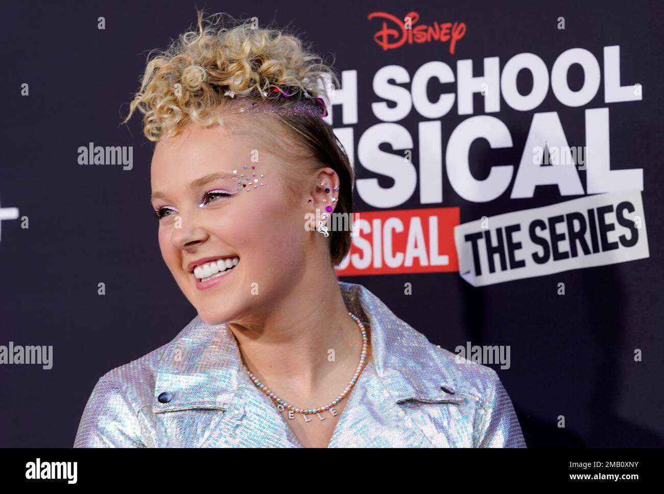 Jojo Siwa poses at the season three premiere of the Disney + streaming ...