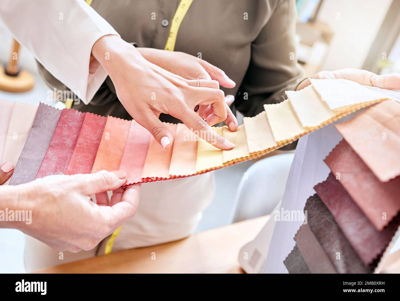 Fashion, hands and women with fabric choice for color in workshop ...