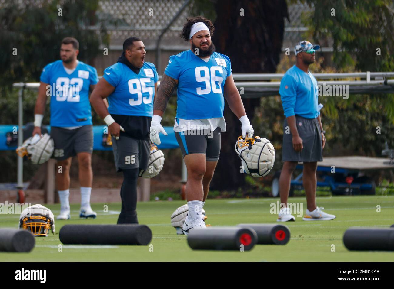 Los Angeles Chargers defensive ends Breiden Fehoko (96), Christian ...