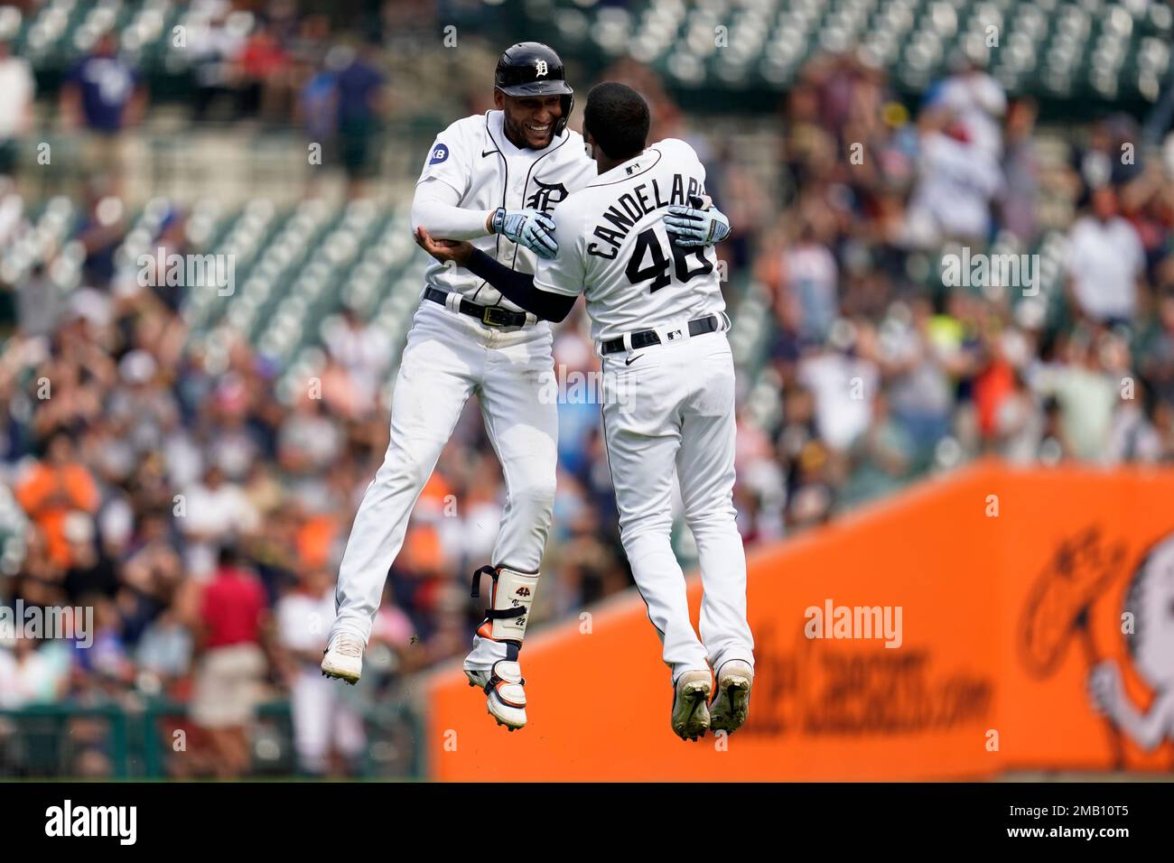Detroit Tigers' Victor Reyes, left, celebrates his two-run double with ...