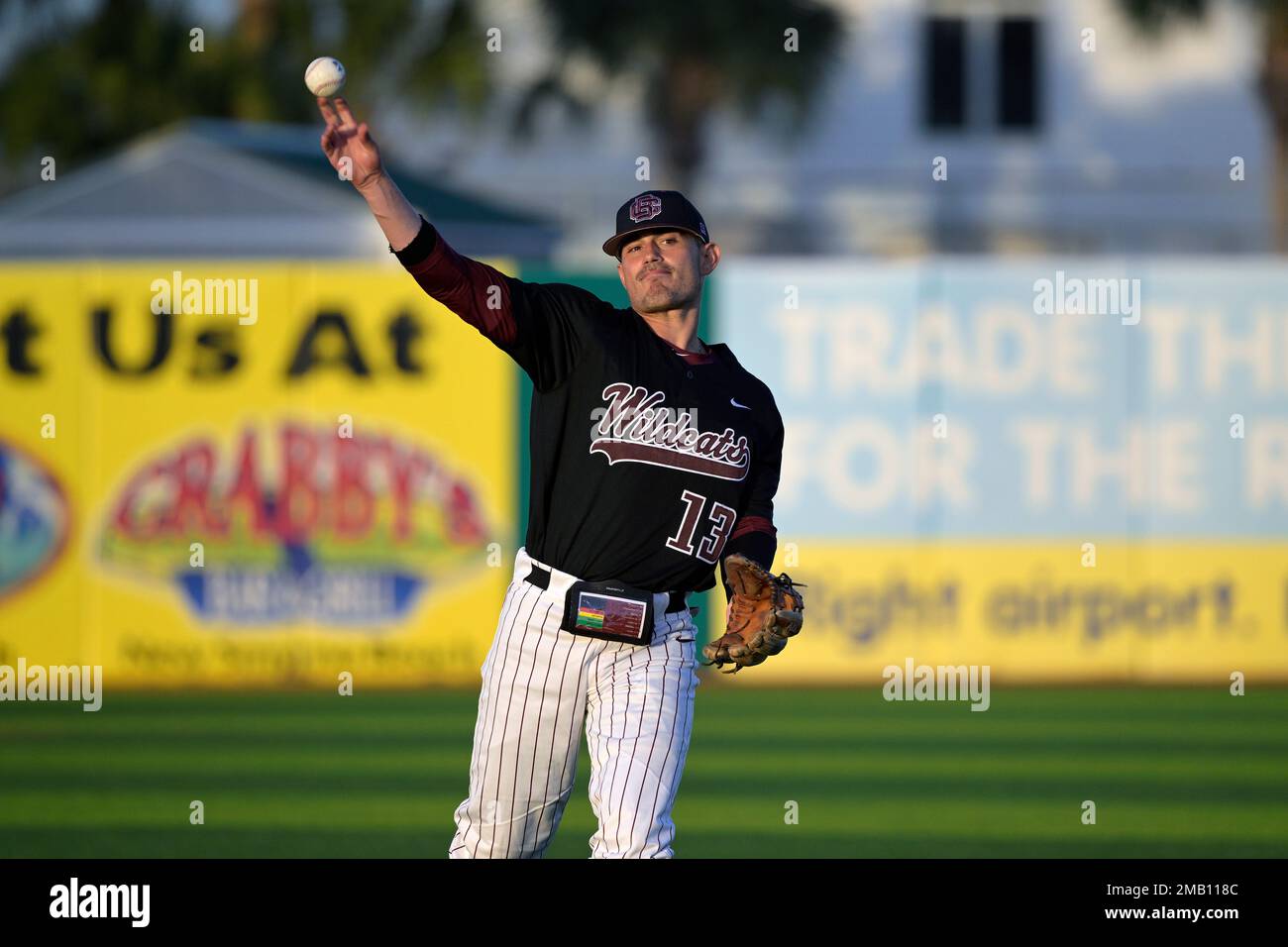 Bethune-Cookman's Brian Perez (13) warms up before an NCAA baseball ...