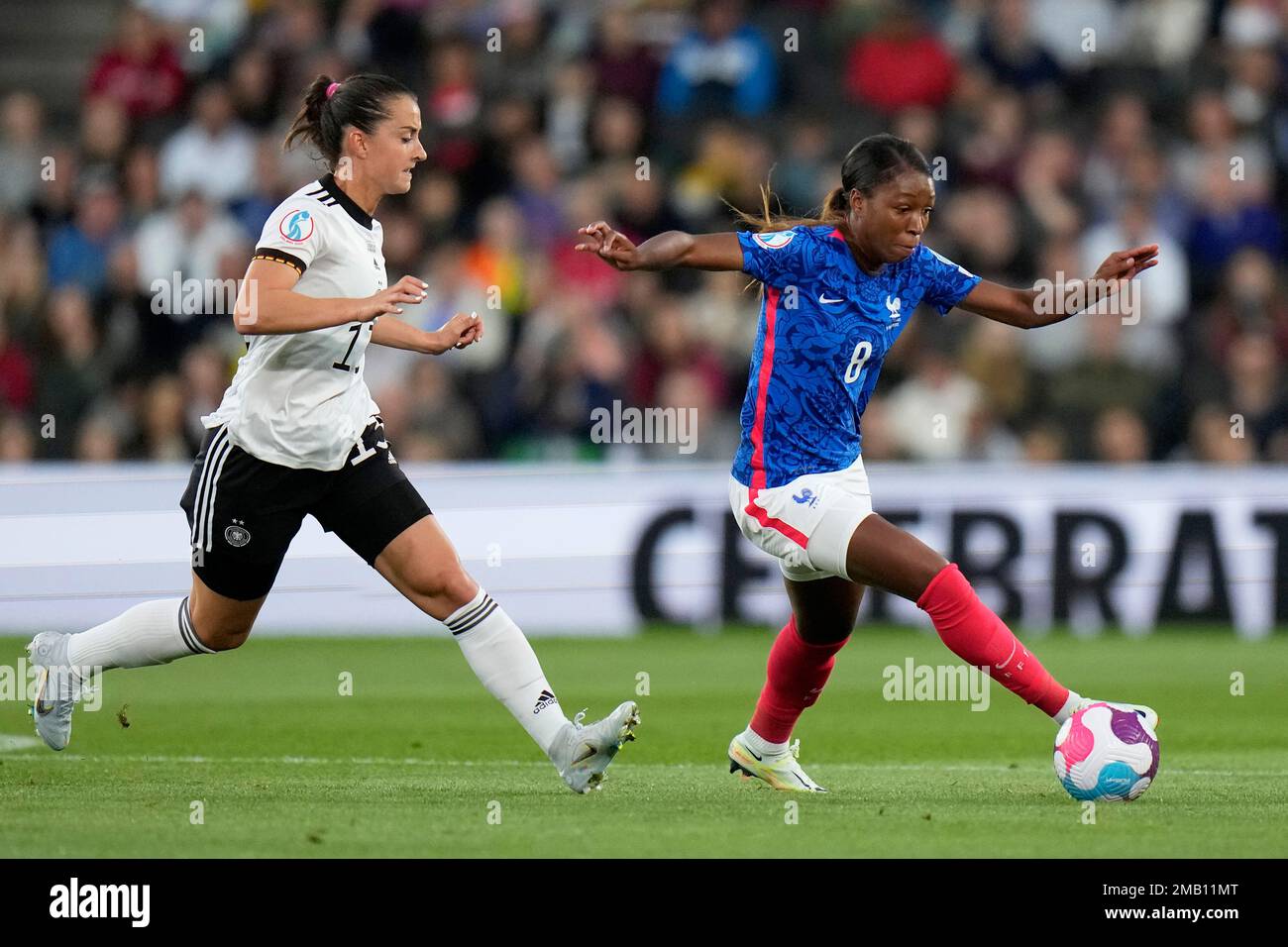 France's Grace Geyoro runs with the ball followed by Germany's Sara ...
