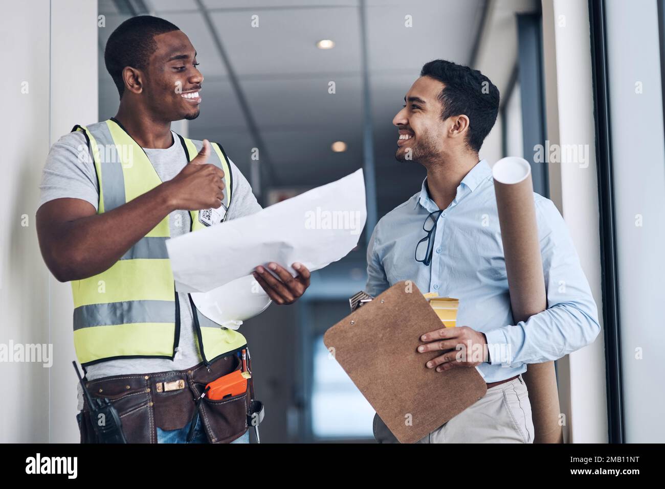 I understand you completely. two young architects standing together and ...