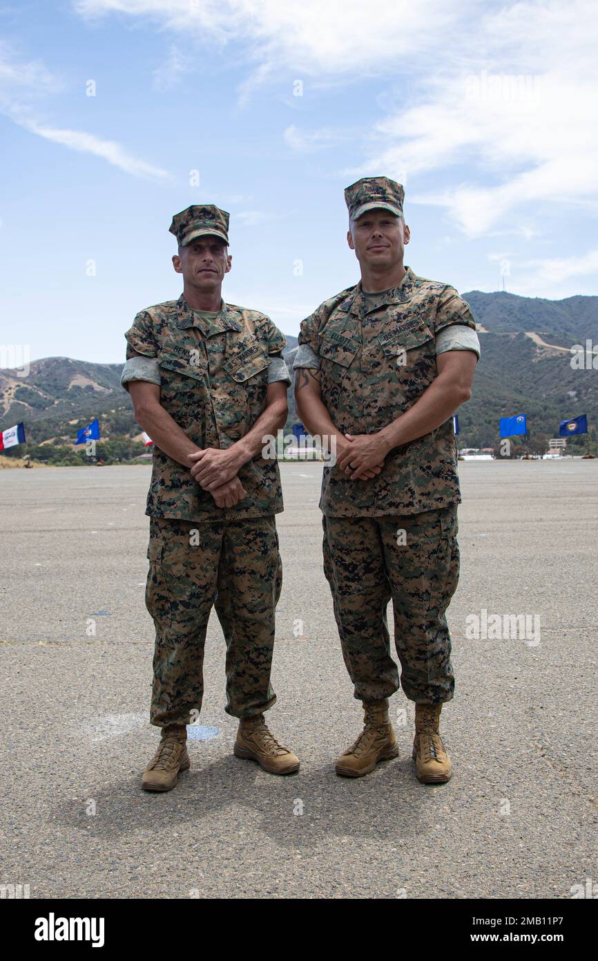 U.S. Marine Corps Sgt. Maj. Dustin R. Benson (left), the incoming ...