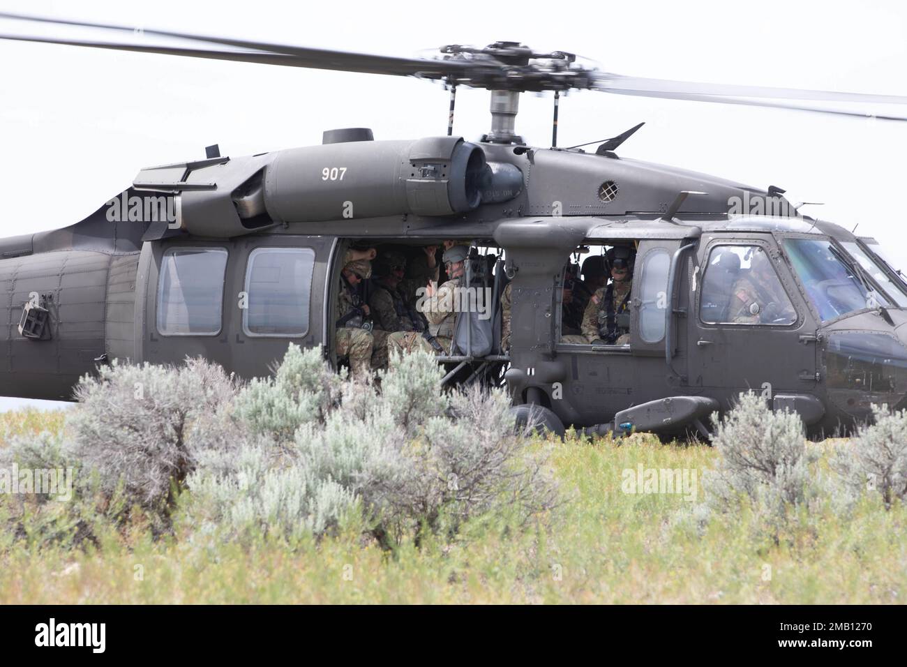 Forward observers board a UH-60 helicopter for transport to an ...