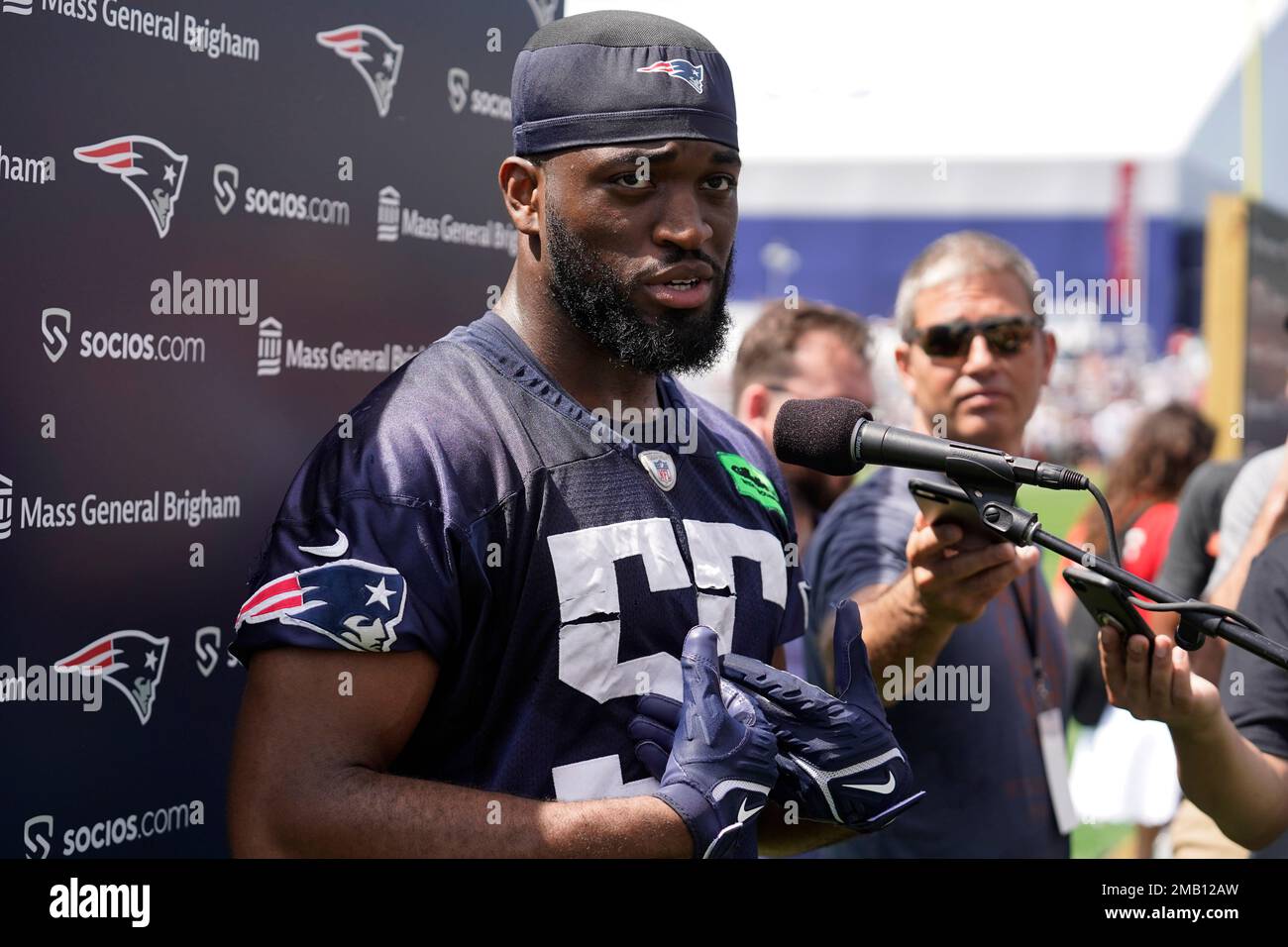 New England Patriots linebacker Josh Uche faces reporters following ...