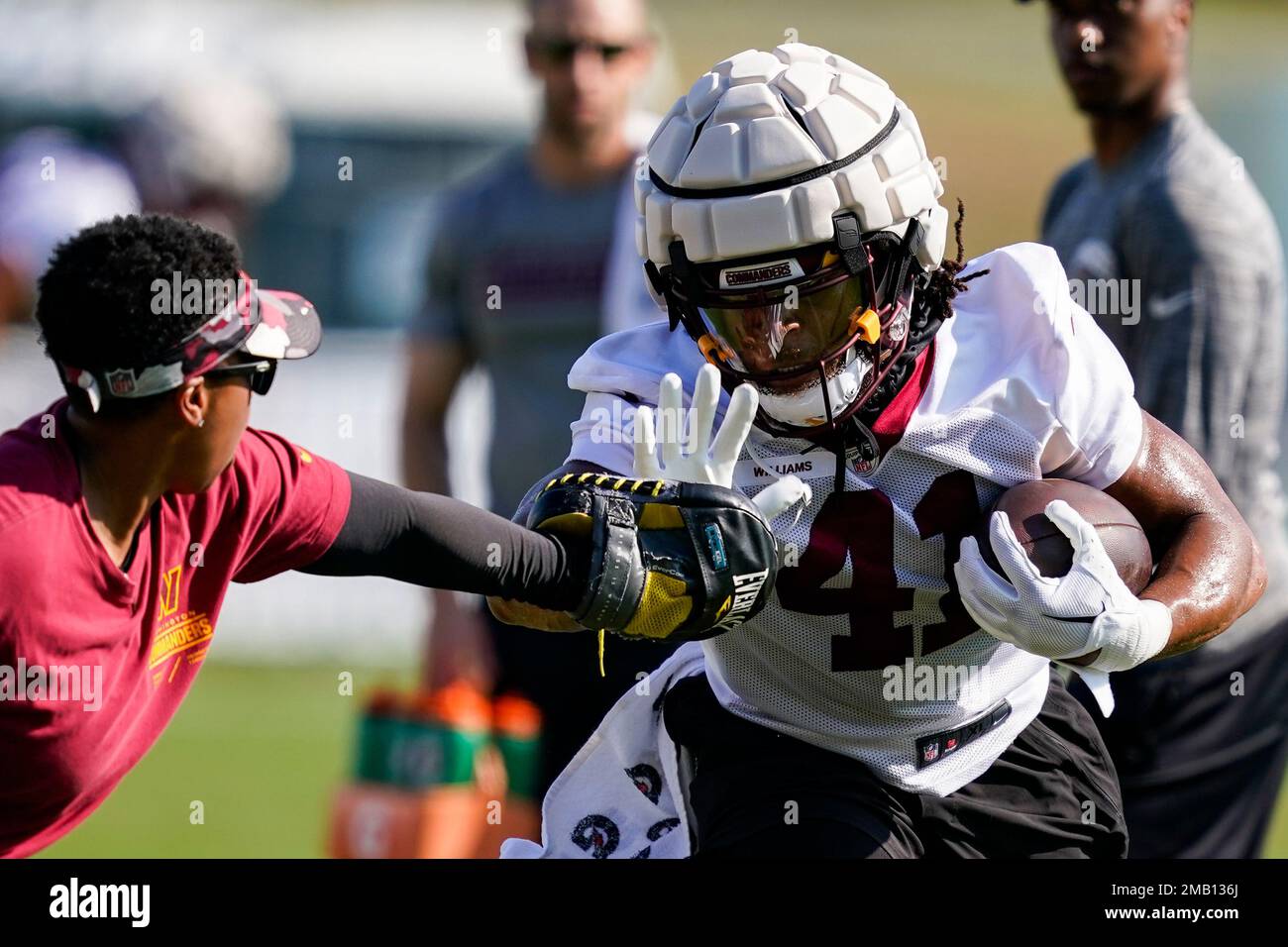 Washington Commanders running back Jonathan Williams (41) runs a drill ...