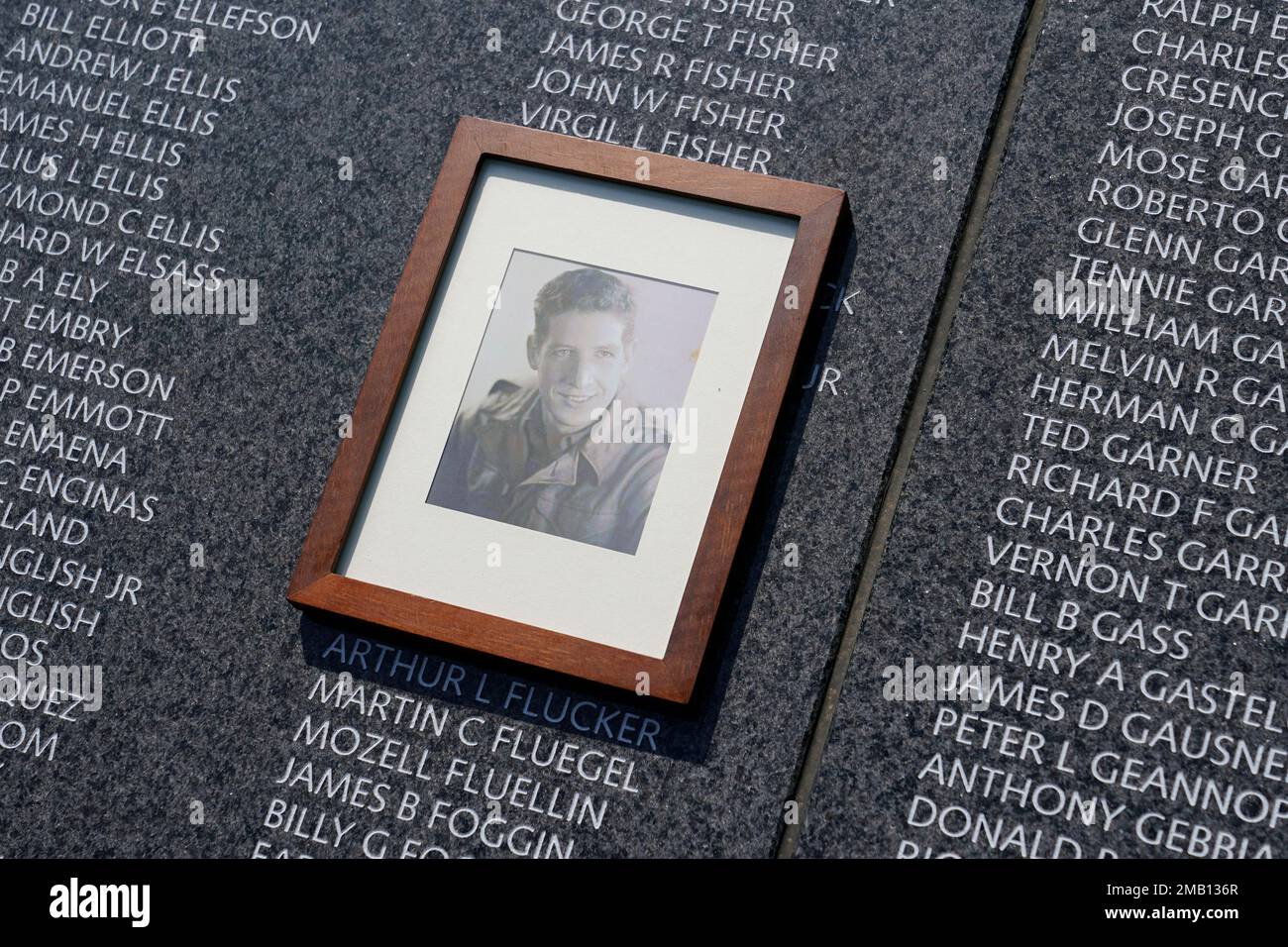 A photograph of U.S. Army Sgt. John Fisher, of Sugar Notch, Pa., rests ...