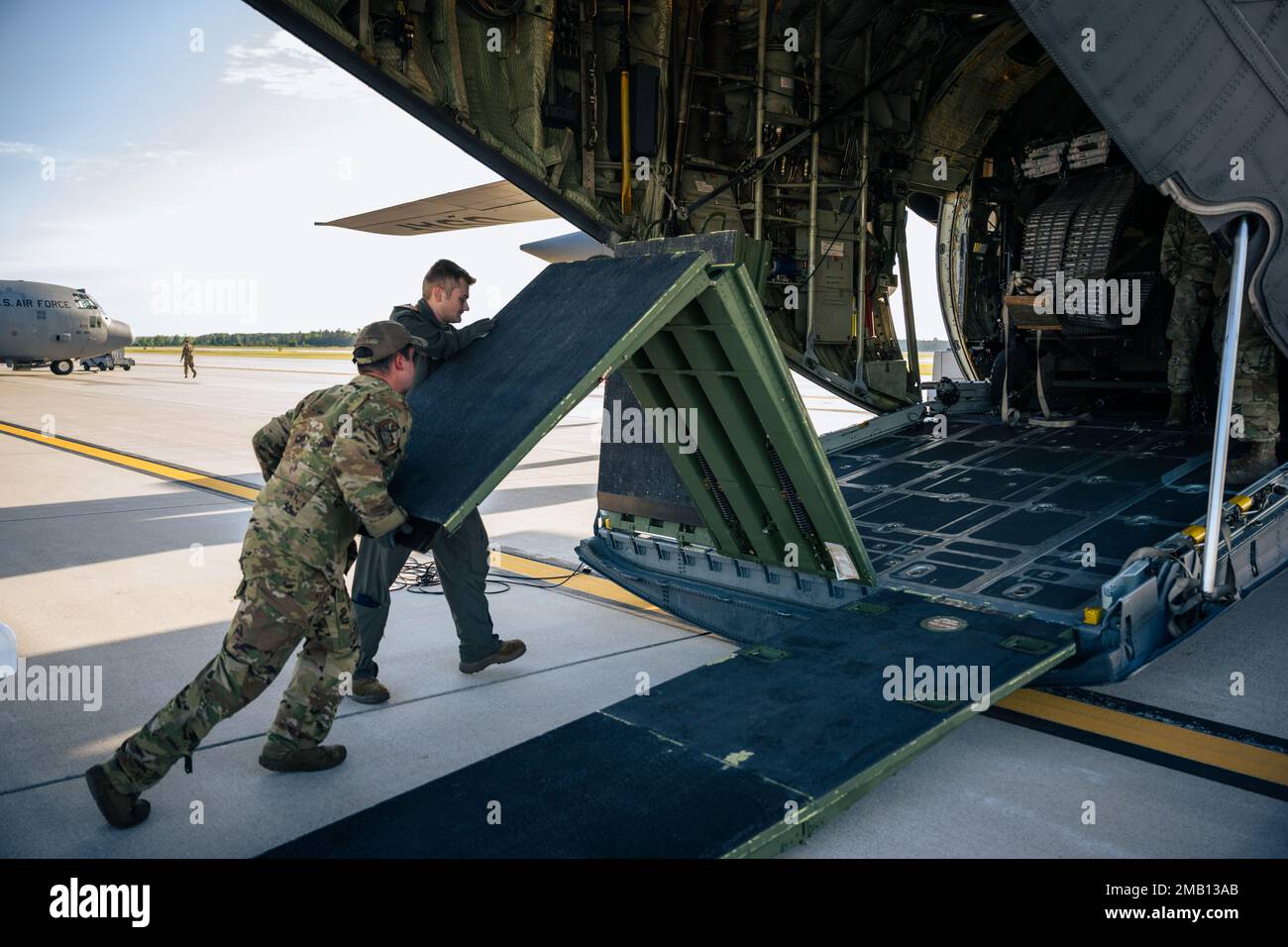 U.S. Air Force Airmen Staff Sgt. Cy Snyder III and Senior Airman Naden ...