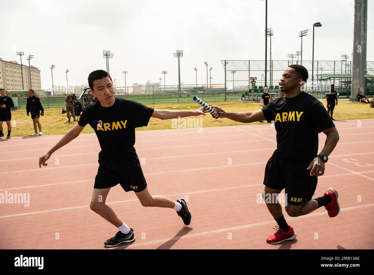 Combined teams of KATUSA and U.S. Soldiers participate in a 4x4 relay ...
