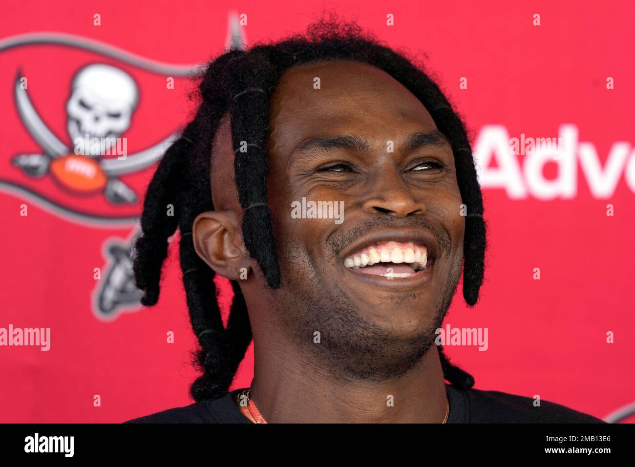 New Tampa Bay Buccaneers wide receiver Julio Jones smiles at a question ...