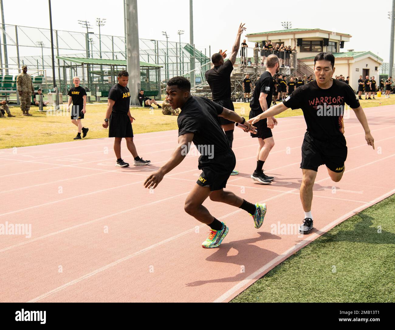 Combined teams of KATUSA and U.S. Soldiers participate in a 4x4 relay ...