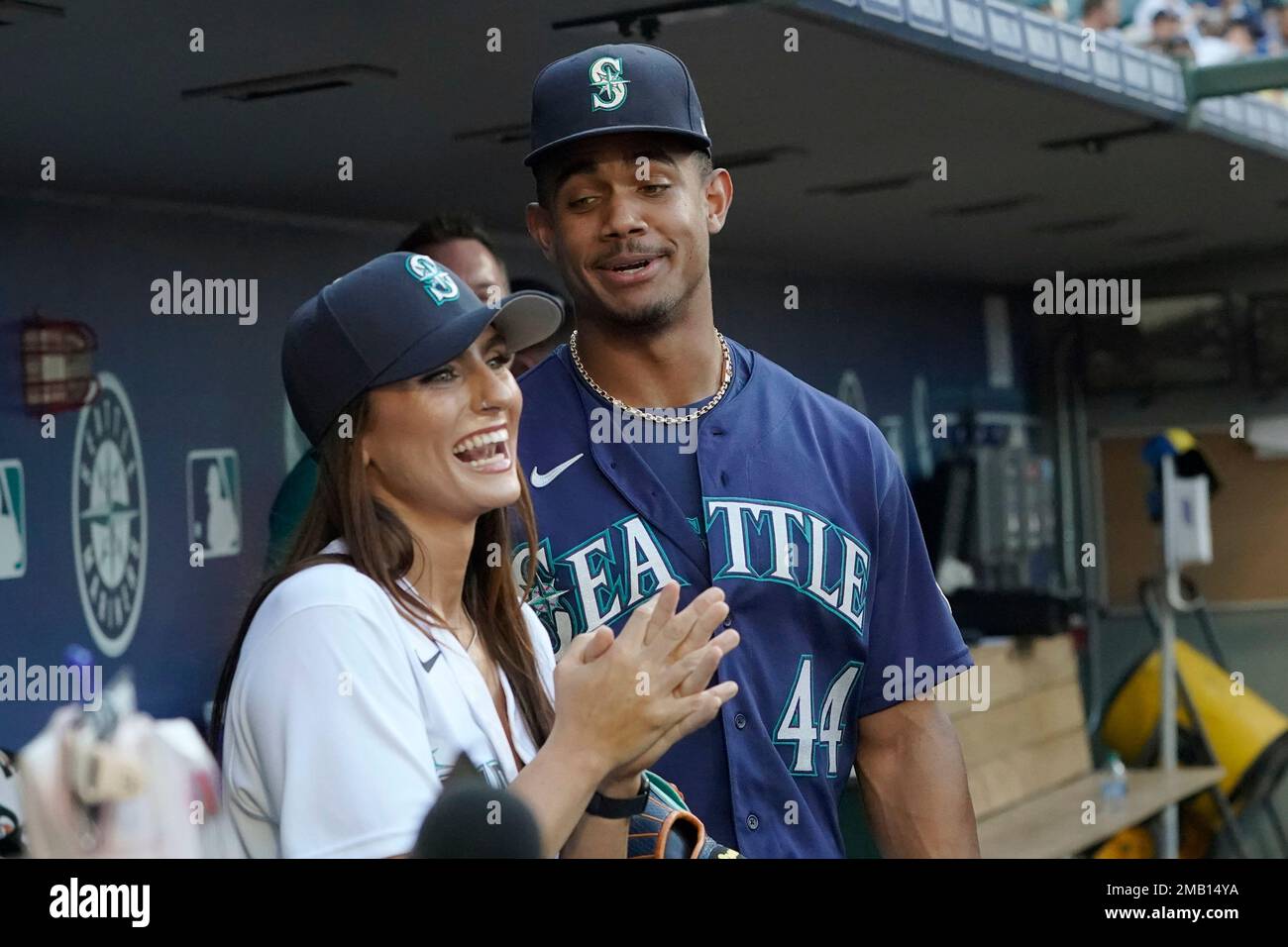 Seattle Mariners center fielder Julio Rodriguez, right, talks with ...